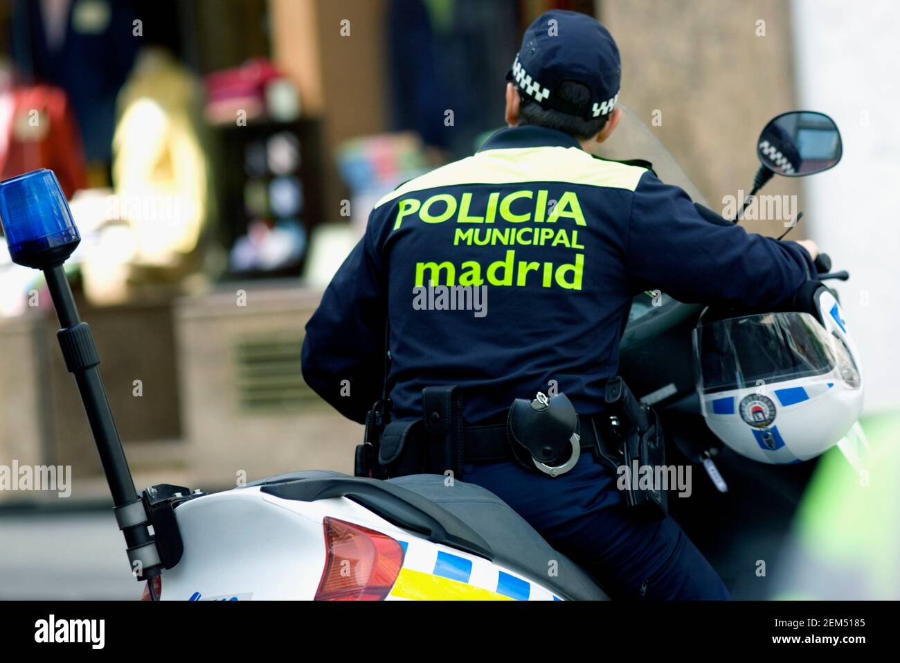 Rear view of a traffic cop riding a motorcycle, Madrid, Spain Stock ...