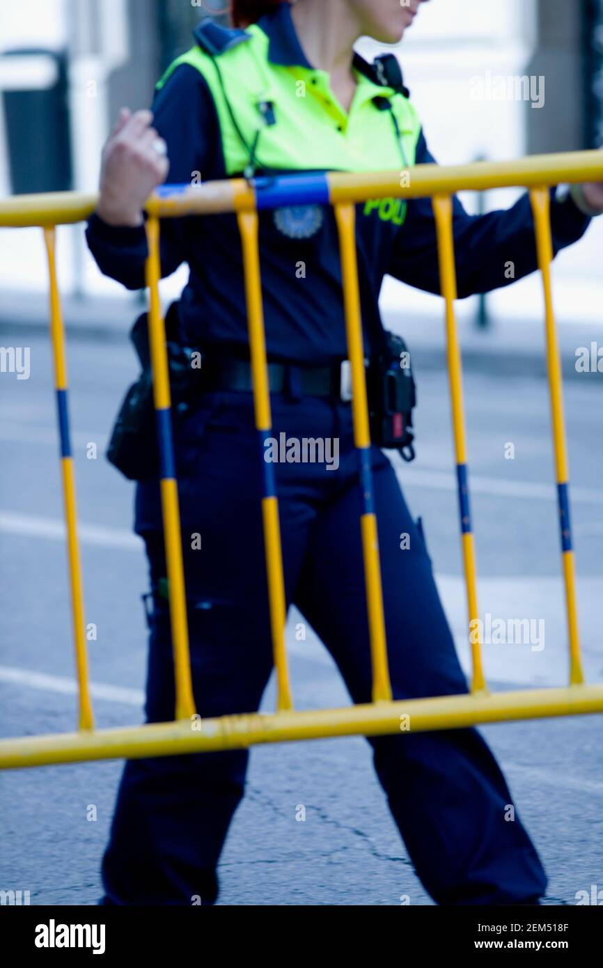 Female traffic cop holding a ladder, Madrid, Spain Stock Photo - Alamy
