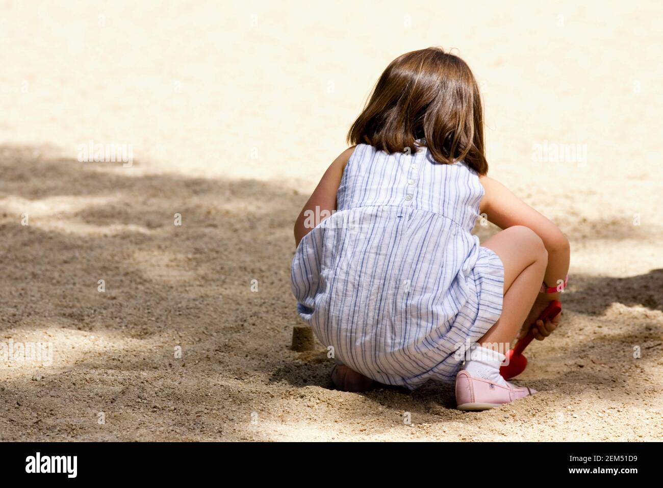 Girl playing in the sand hi-res stock photography and images - Alamy