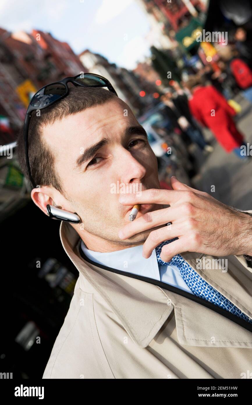 Portrait of a businessman smoking a cigarette Stock Photo - Alamy