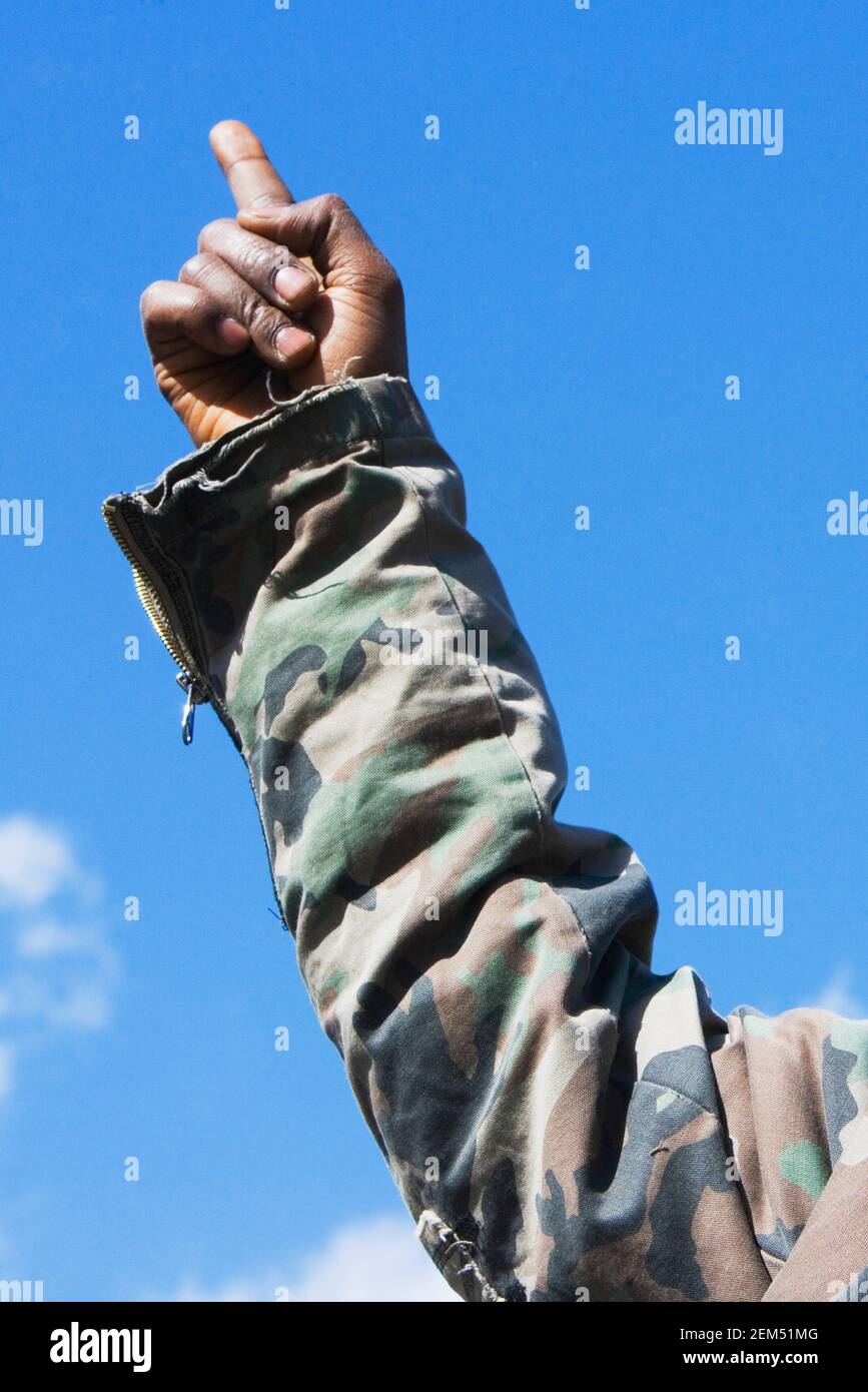 Low angle view of a person's hand pointing upwards Stock Photo - Alamy