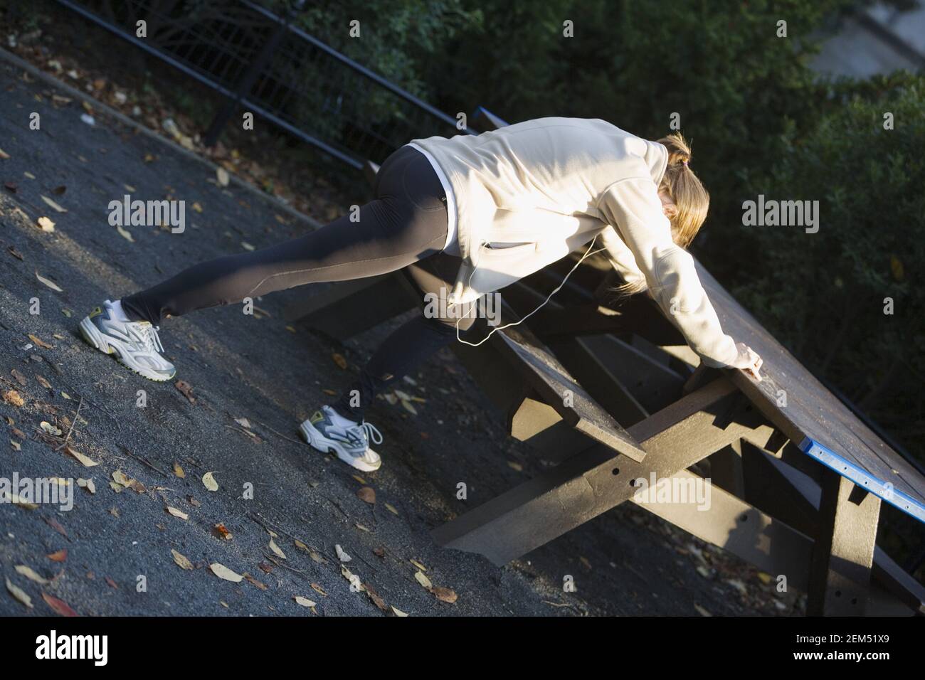 Woman bending over table hi-res stock photography and images - Alamy