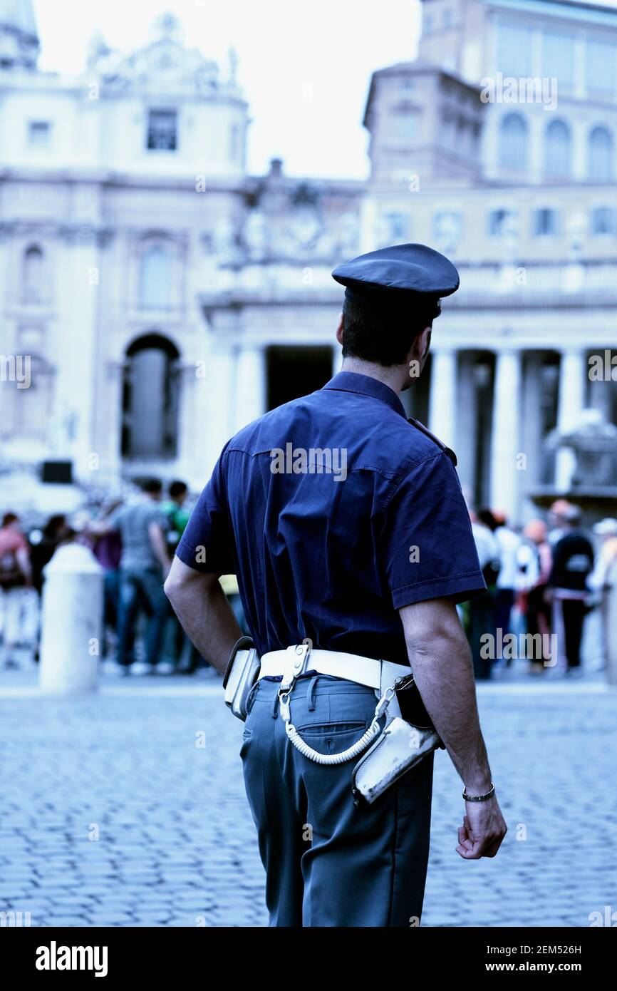 Rear view of a policeman standing, Rome, Italy Stock Photo - Alamy