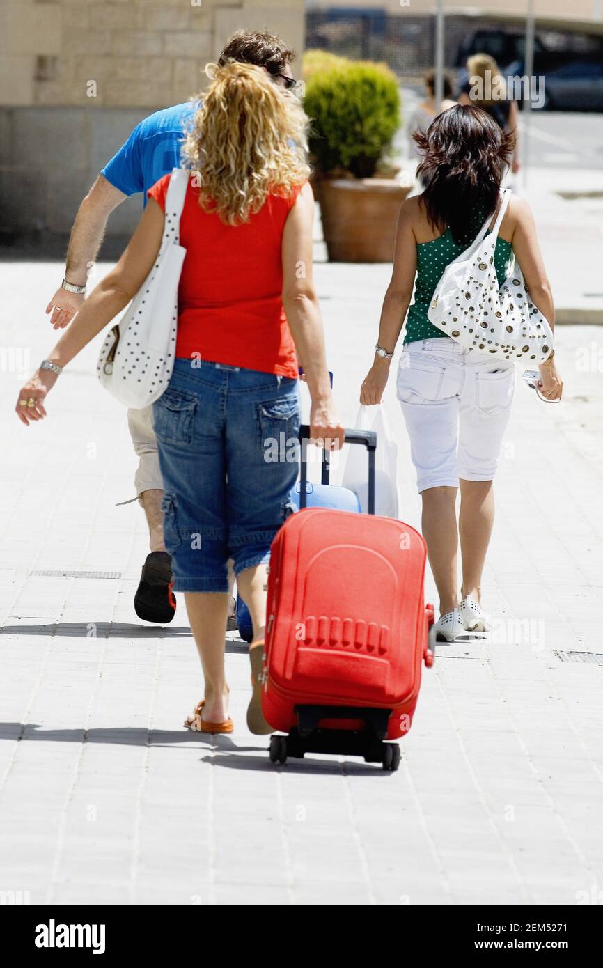 Two men carrying a bag hi-res stock photography and images - Alamy