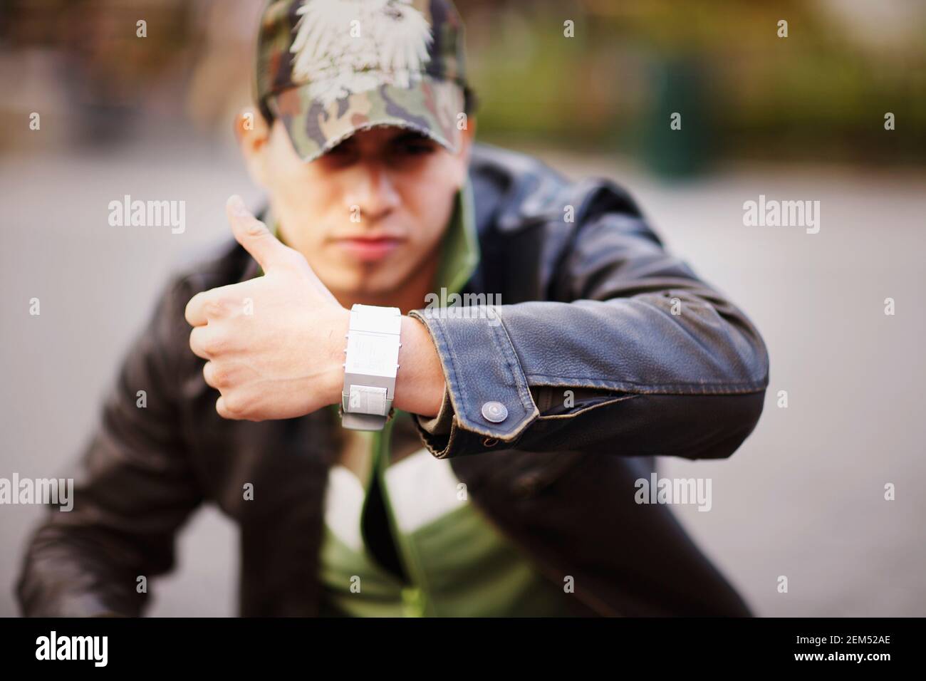 Young hispanic man thumb up hi-res stock photography and images - Alamy