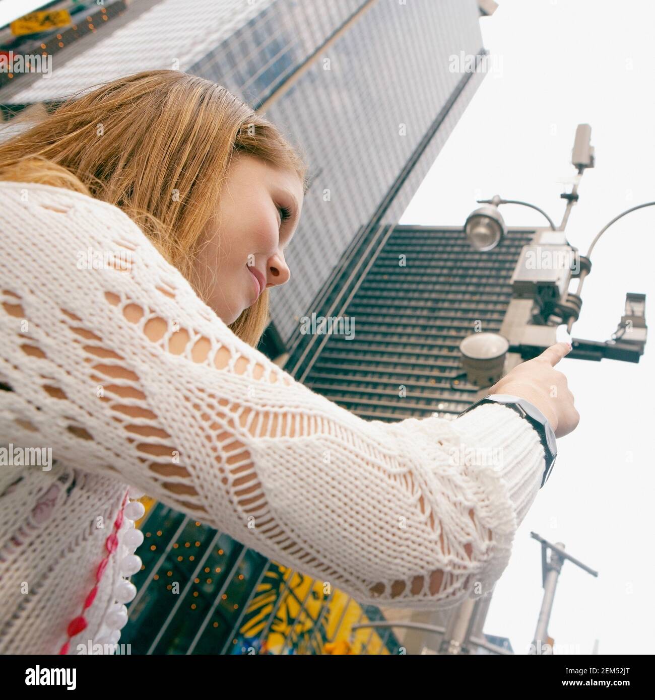 Low angle view of a teenage girl pointing up Stock Photo - Alamy