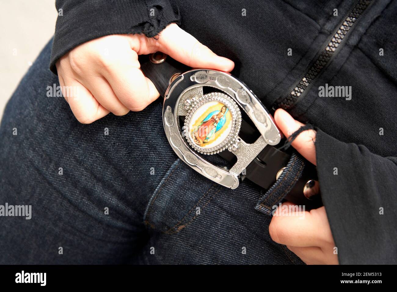 One woman holding belt hi-res stock photography and images - Alamy