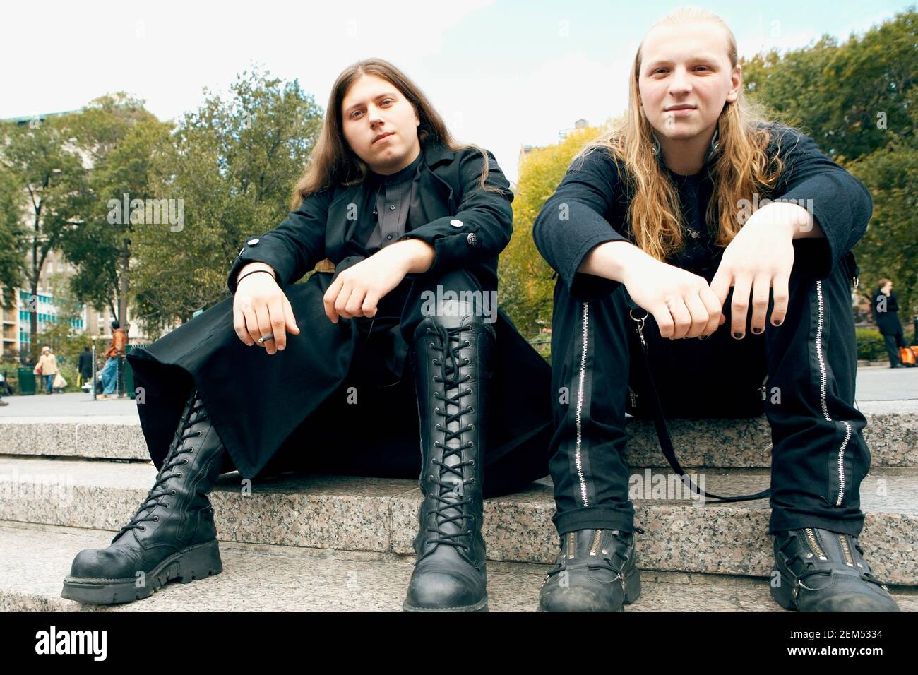 Portrait of two young men sitting on steps Stock Photo - Alamy