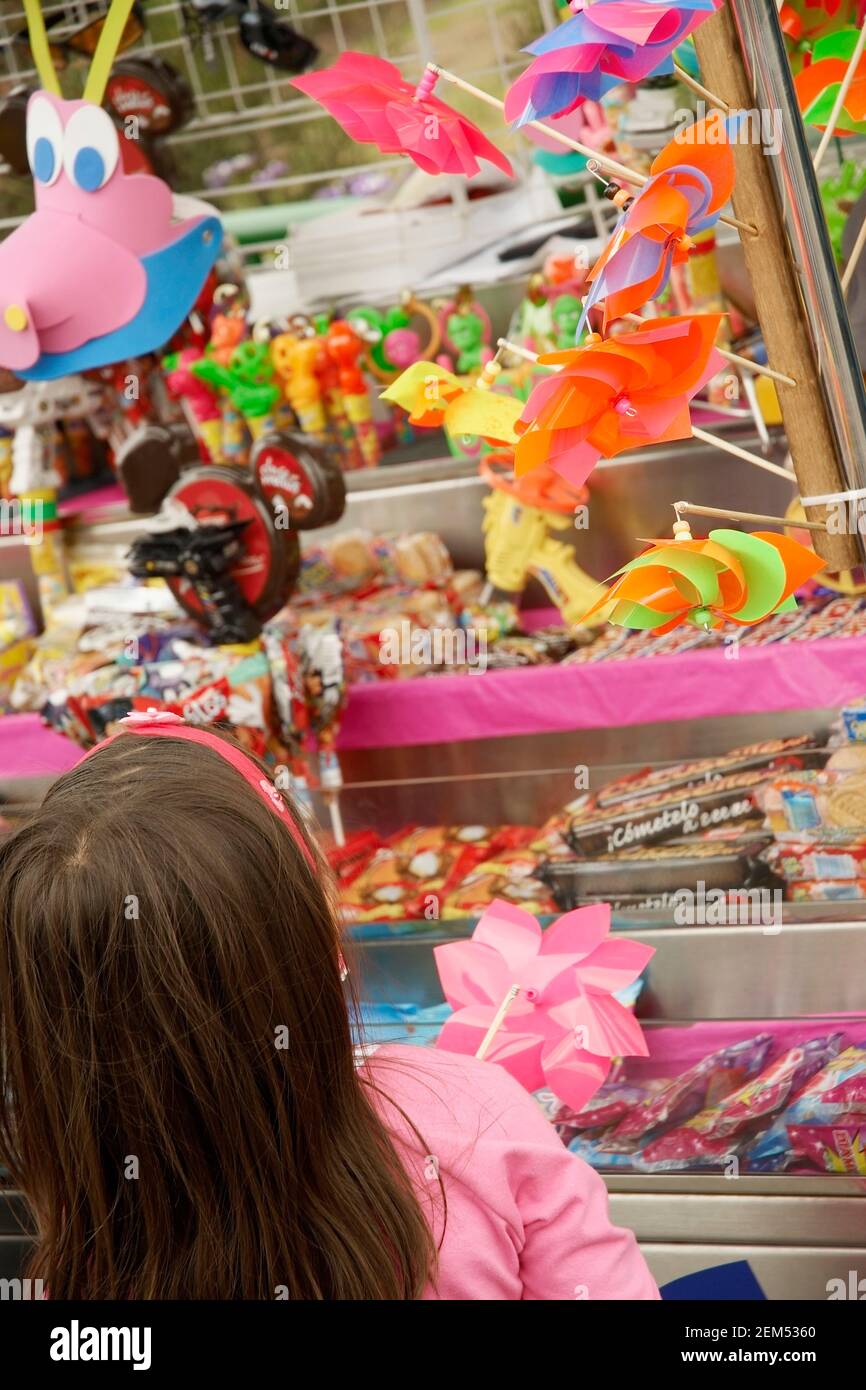 Rear view of a girl at a market stall Stock Photo - Alamy