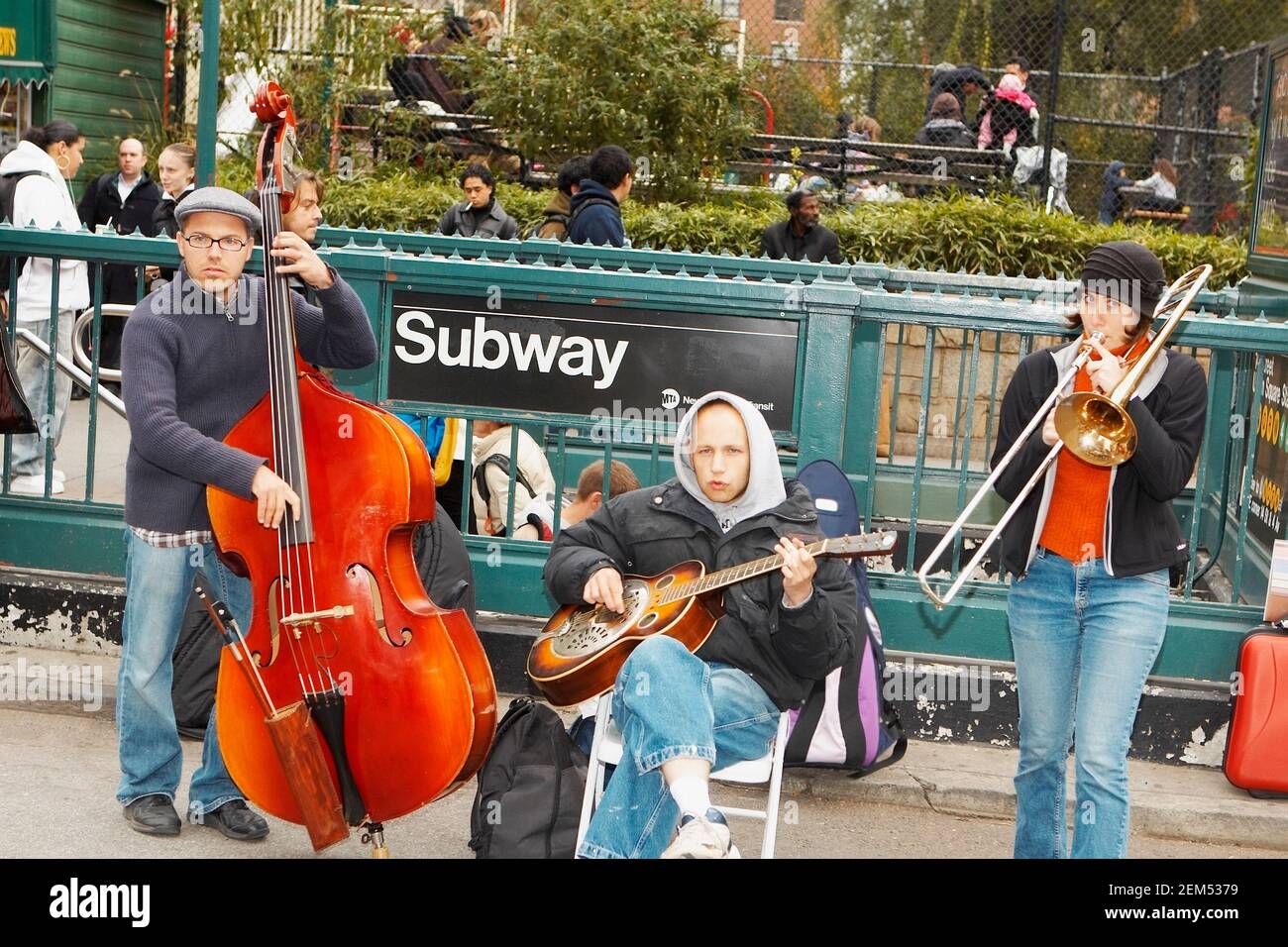Three street musicians performing Stock Photo - Alamy