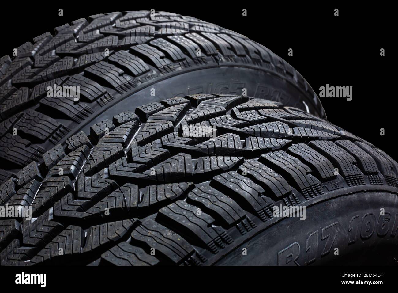 two tires on gray background Stock Photo - Alamy