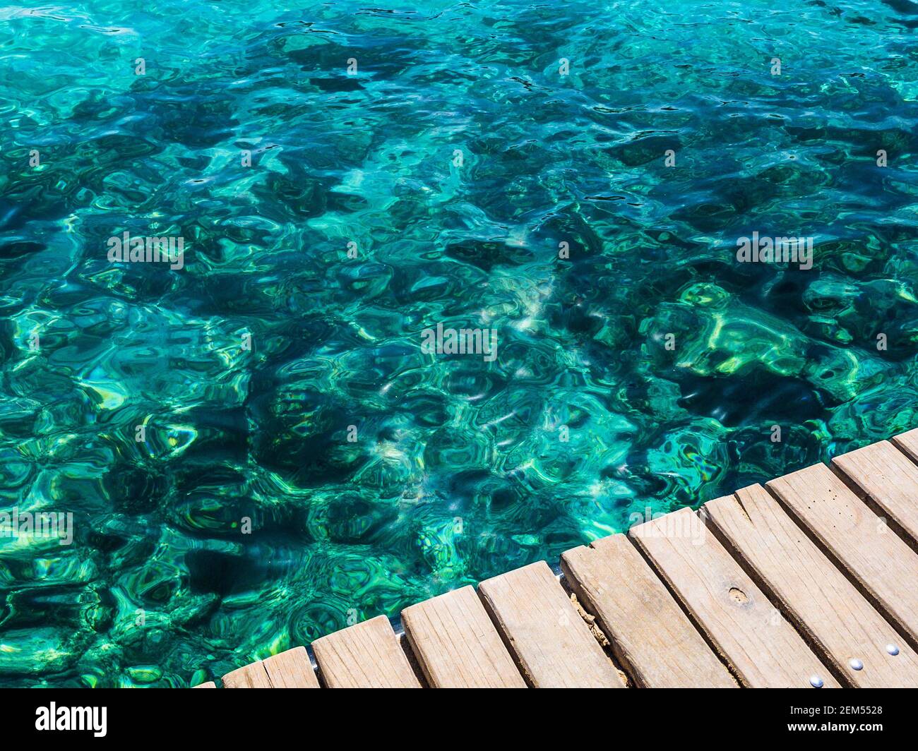 Turquoise water in the famous Blue Lagoon in the Mediterranean Sea ...
