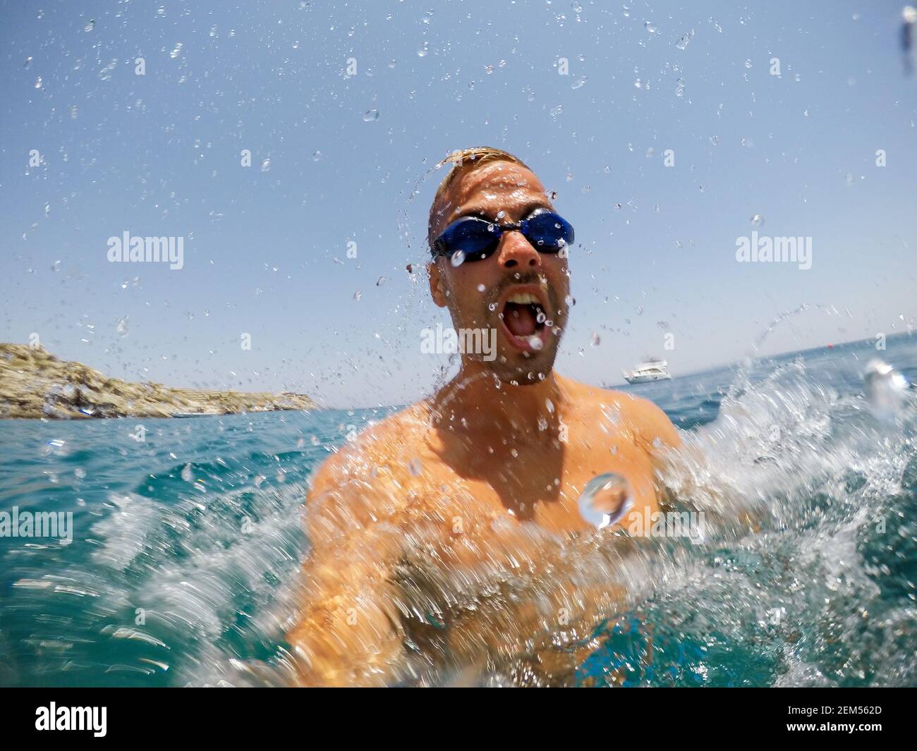Unsure drowning man in the sea with panic reaction screaming for help ...