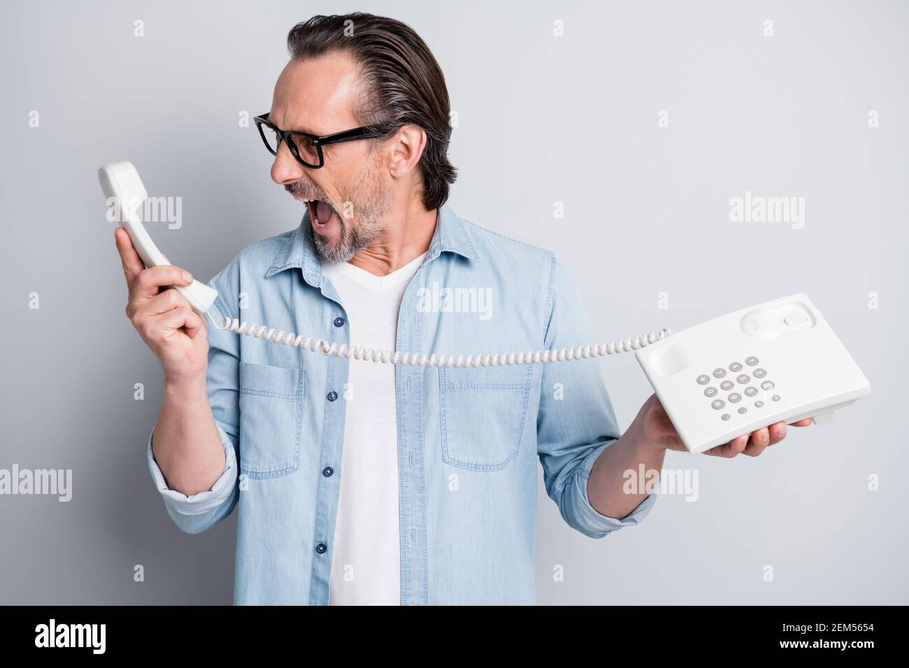 Photo of angry mad man unhappy yell scream phone call helpline conflict ...