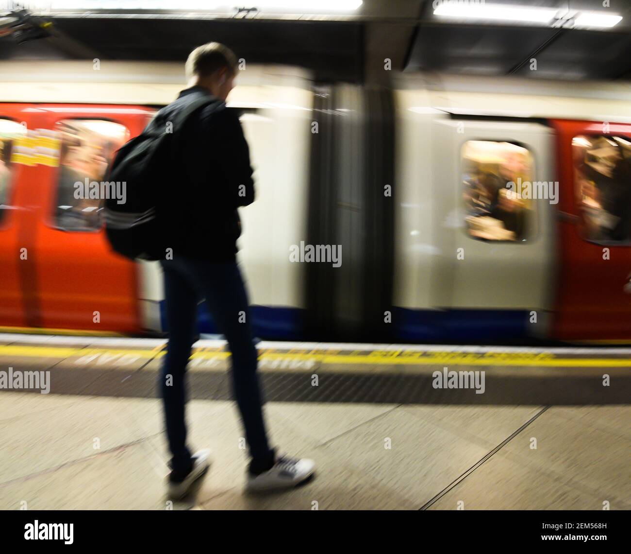 Random passenger people at the underground tube station tfl with moving ...