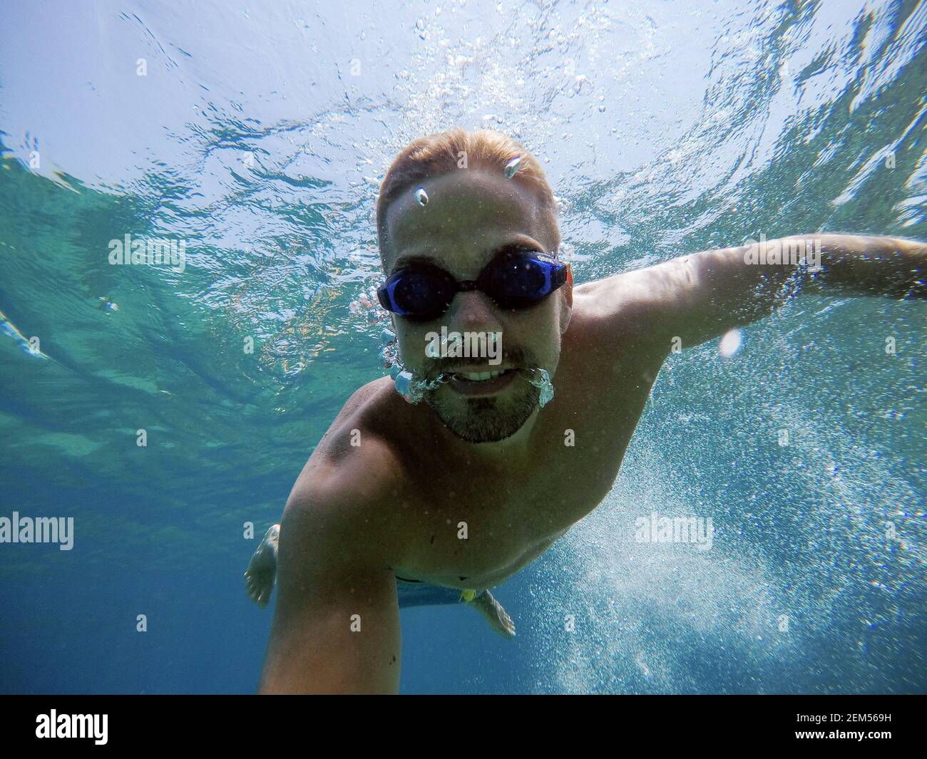 Man Smiling Underwater Underwater View High Resolution Stock ...