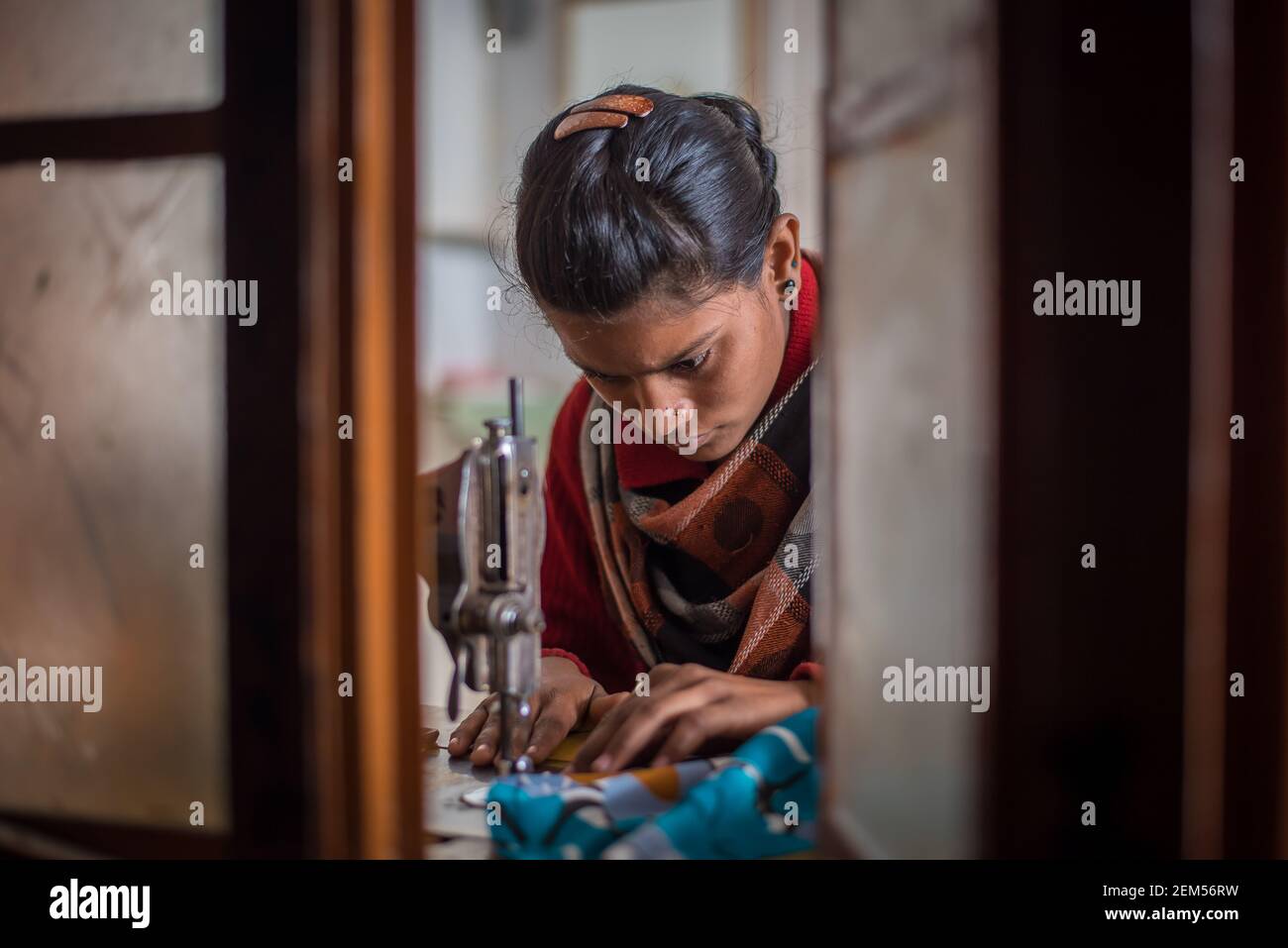 Indian woman sewing hi-res stock photography and images - Alamy