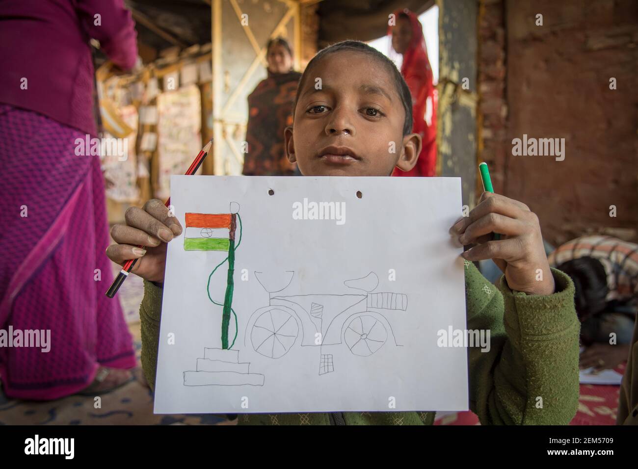 Rajasthan. India. 07-02-2018. A young boy is showing proudly a draw ...