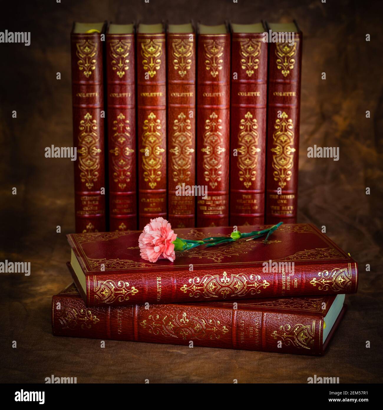 Pink peonies from the garden with a collection of classic literature by ...