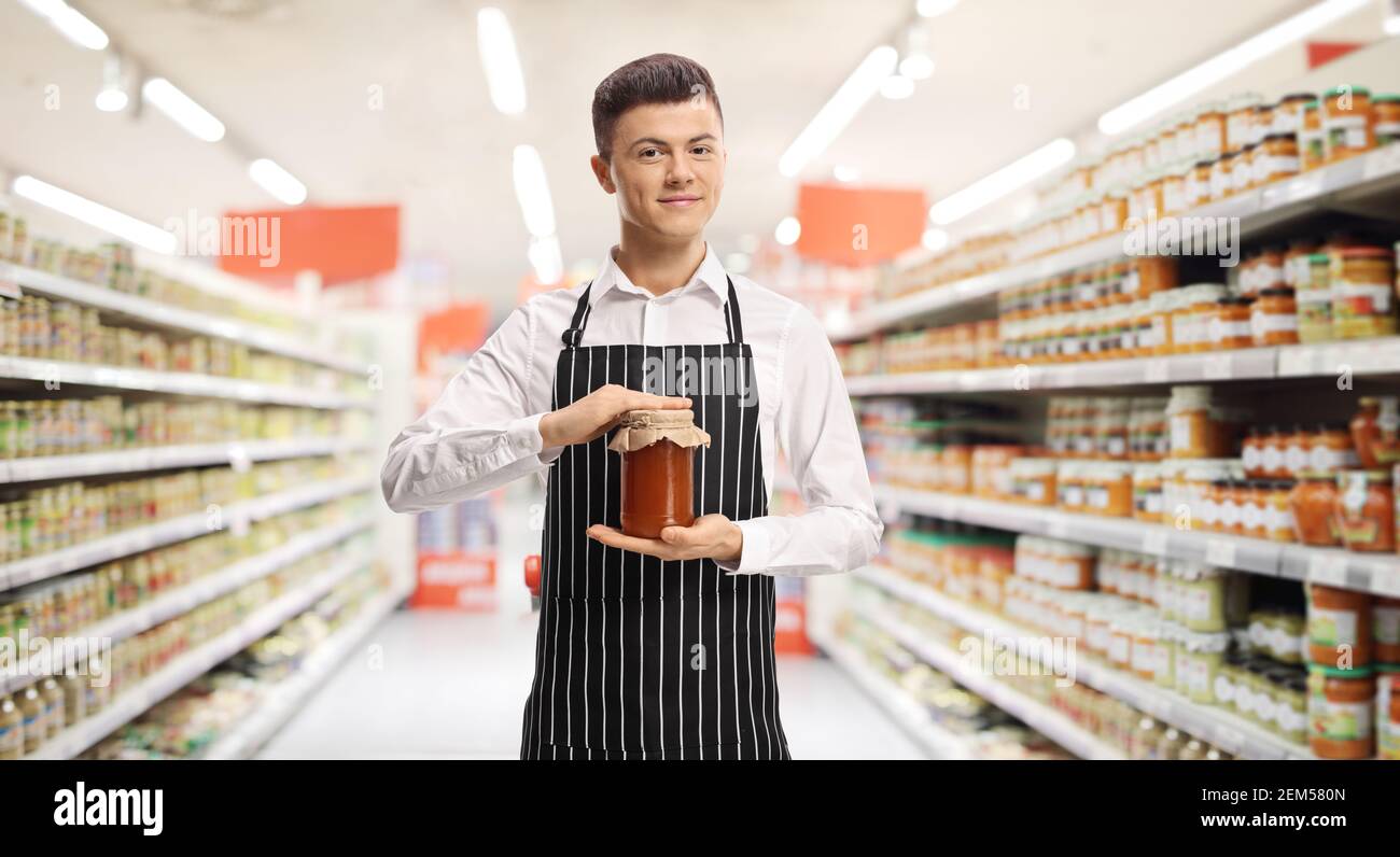 Supermarket shelf worker hi-res stock photography and images - Alamy