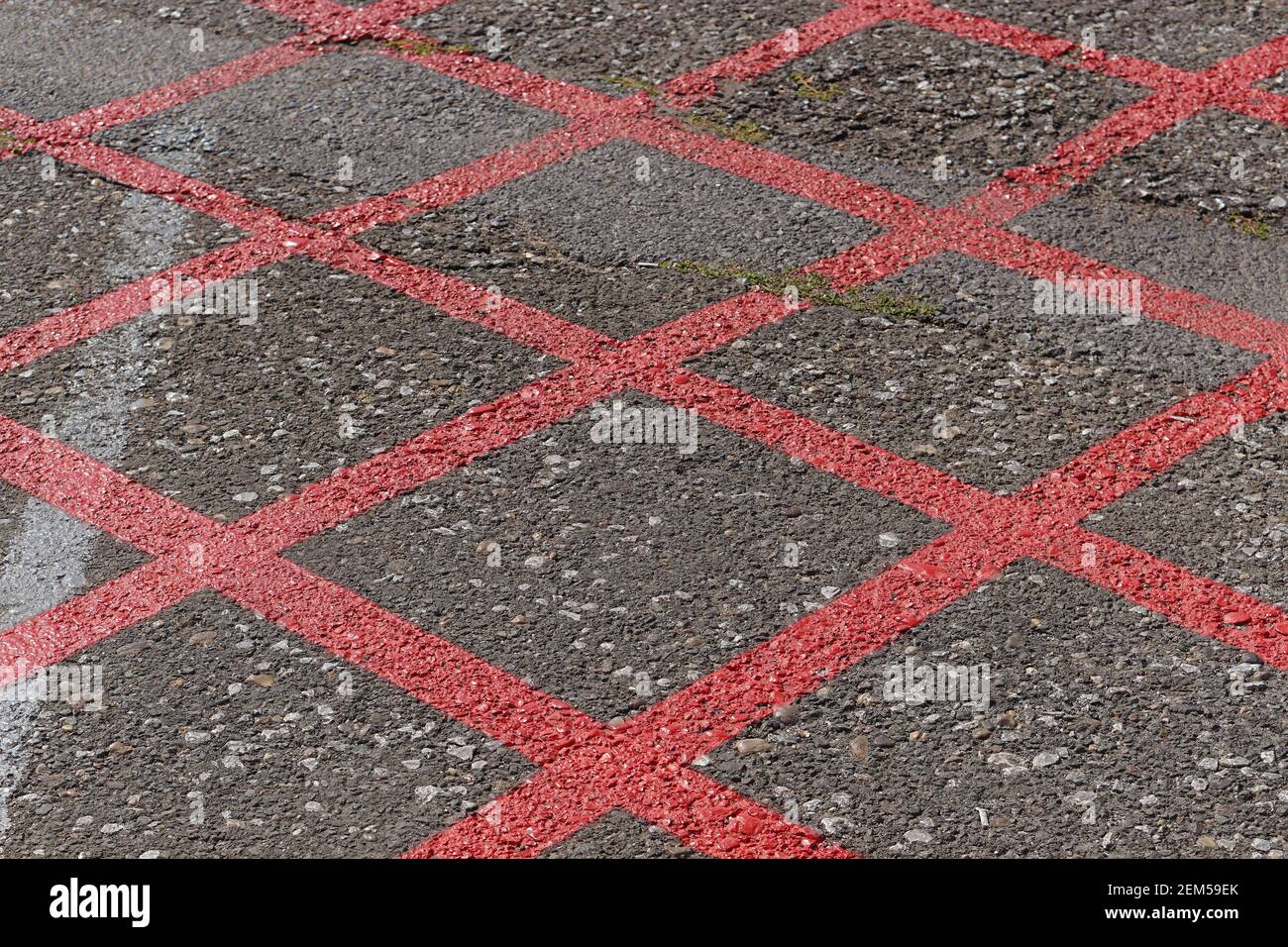 Do not block intersection red lines at street tarmac Stock Photo - Alamy