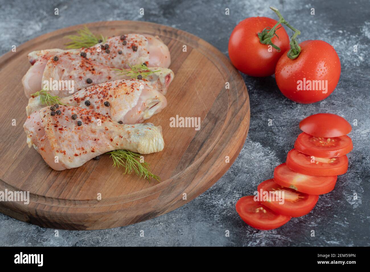 Close up photo of Raw chicken legs with spices and sliced Stock Photo ...