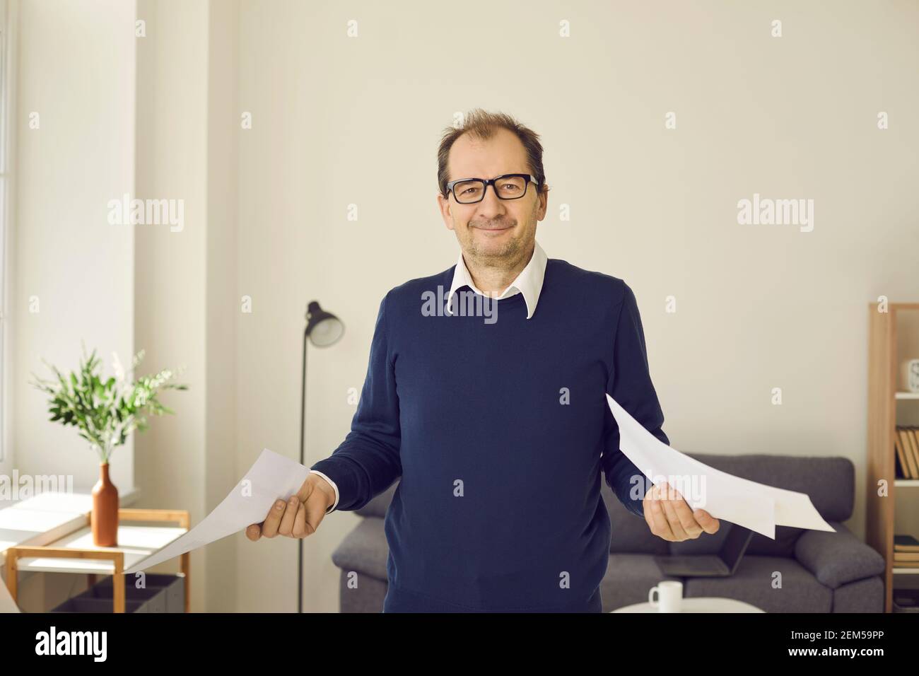 Confused man papers hi-res stock photography and images - Alamy