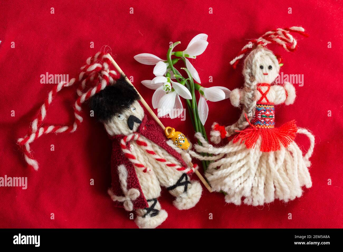 Martenitsa - traditional Bulgarian custom - red background with ...