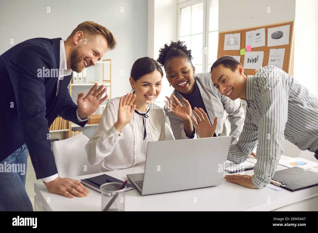 Team of happy diverse business people waving hello to their colleagues ...