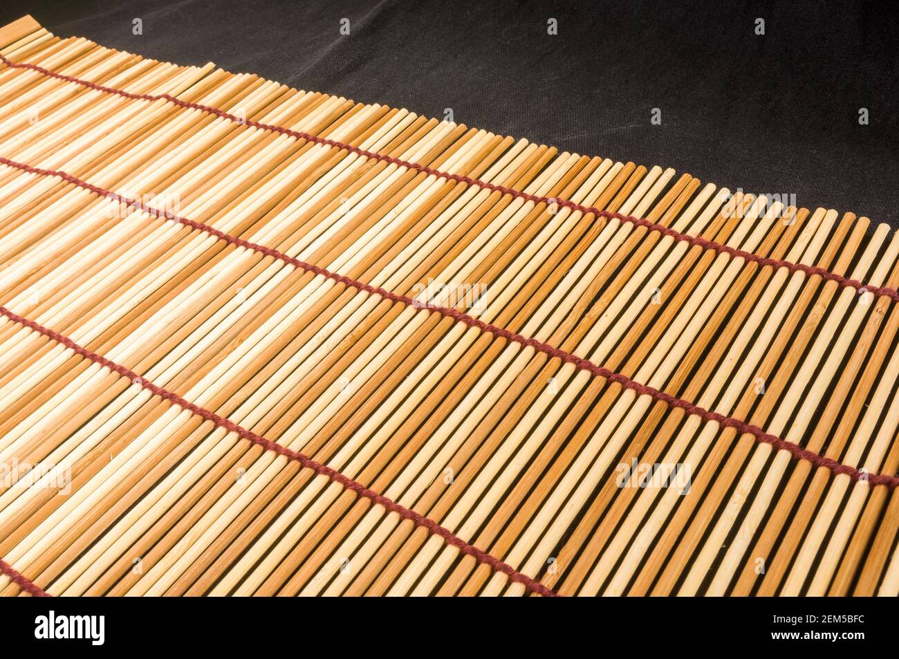 brown bamboo Mat - stand food, close-up, macro, black background Stock ...