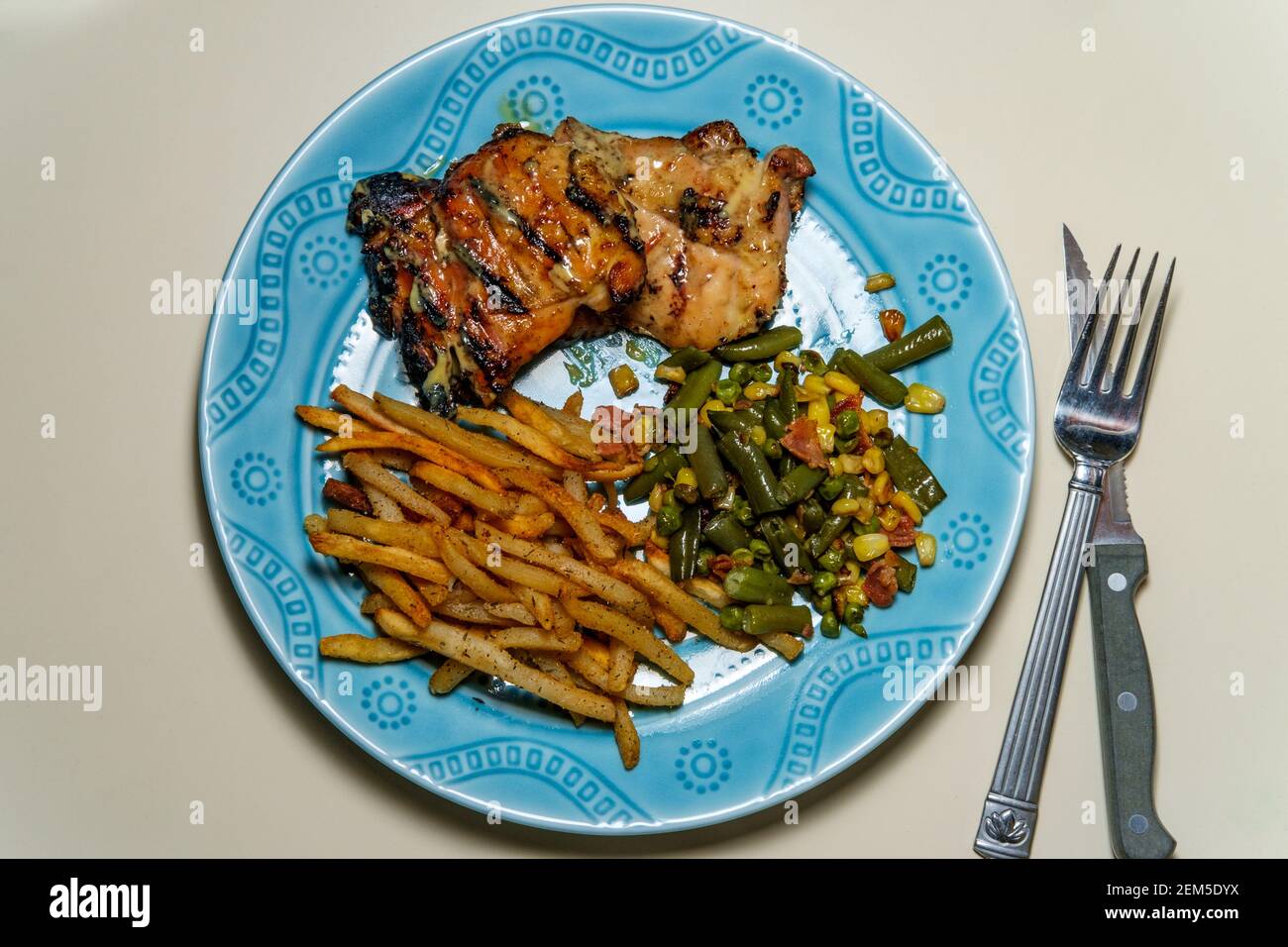 Honey mustard grilled chicken thigh dinner served with home-made ...