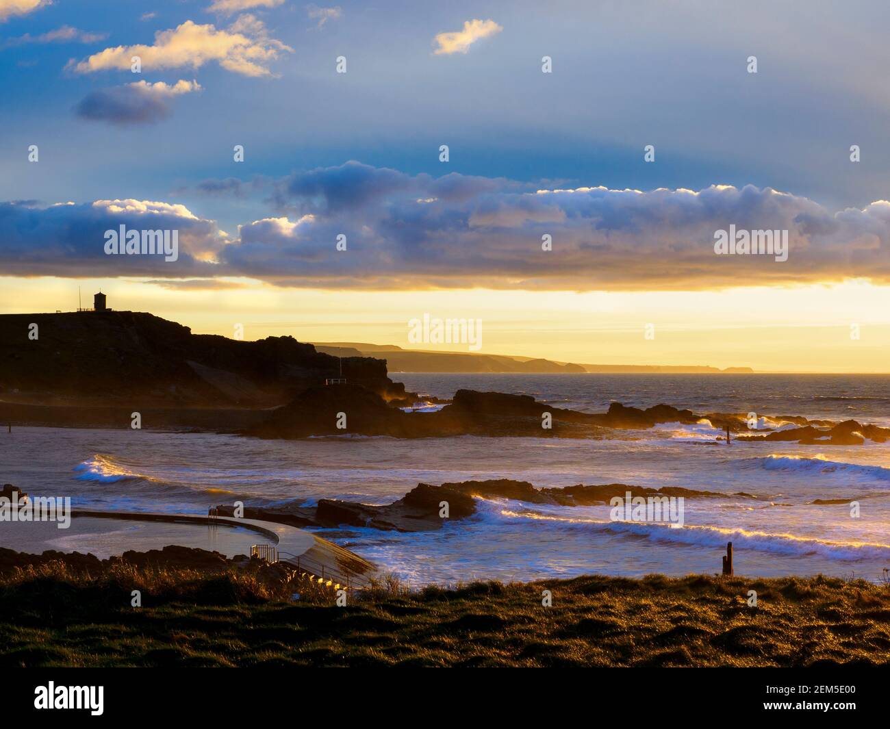 Sunset below the clouds and blue sky above, Bude, Cornwall, UK Stock ...