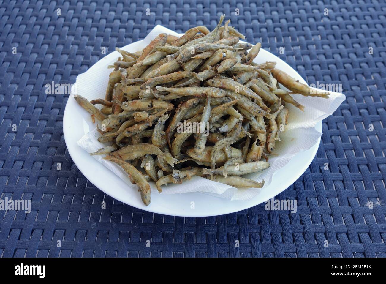 Plate with fried atherina small fish. Greek food Stock Photo - Alamy