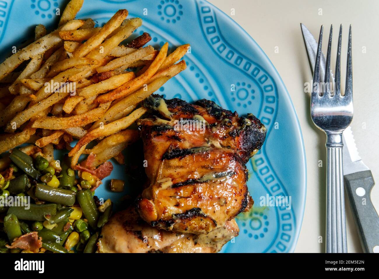 Honey mustard grilled chicken thigh dinner served with home-made ...