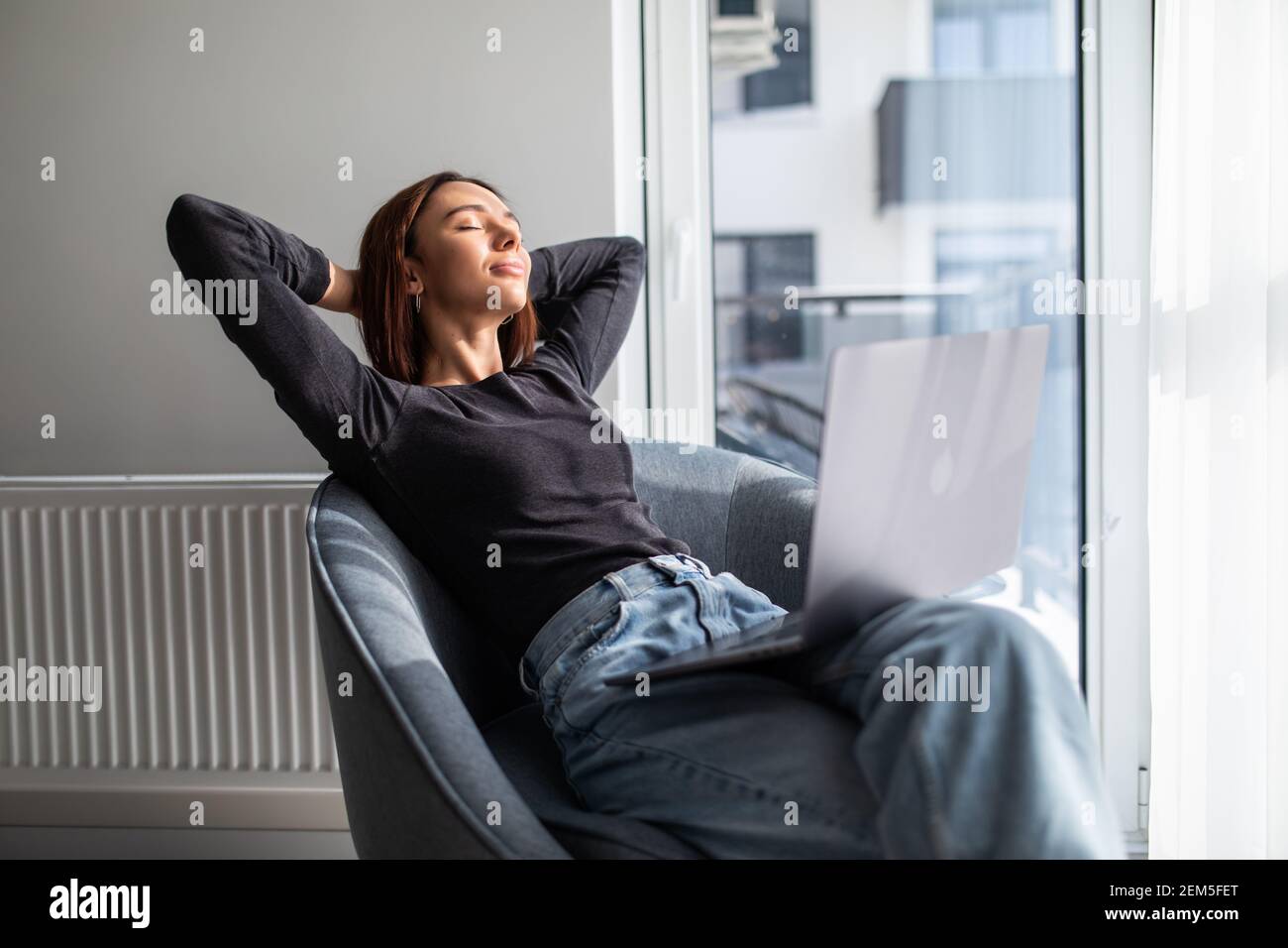 Woman sitting on rocking chair hi-res stock photography and images - Alamy