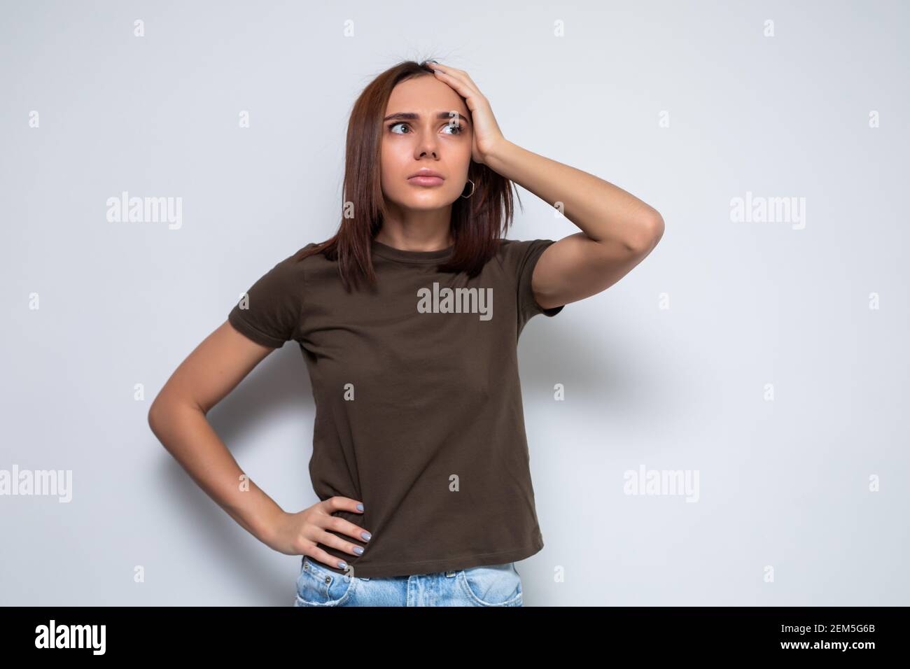 beautiful woman trying to remember something with face expression on ...