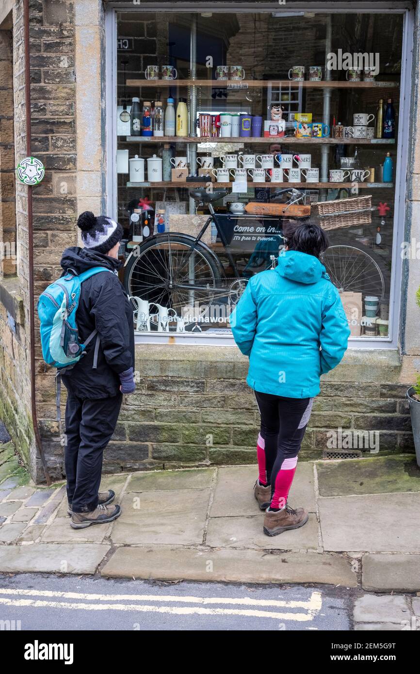 Window shoppers on Main Street in the Village of Haworth, near Bradford ...