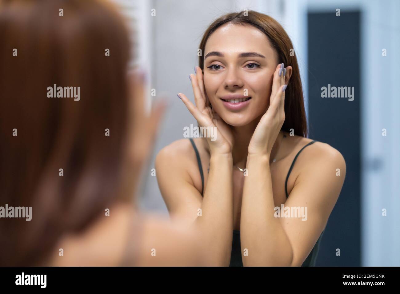 Beauty Skin Care Young Beautiful Teenage Girl Touching Her Face Before The Mirror Enjoying Her