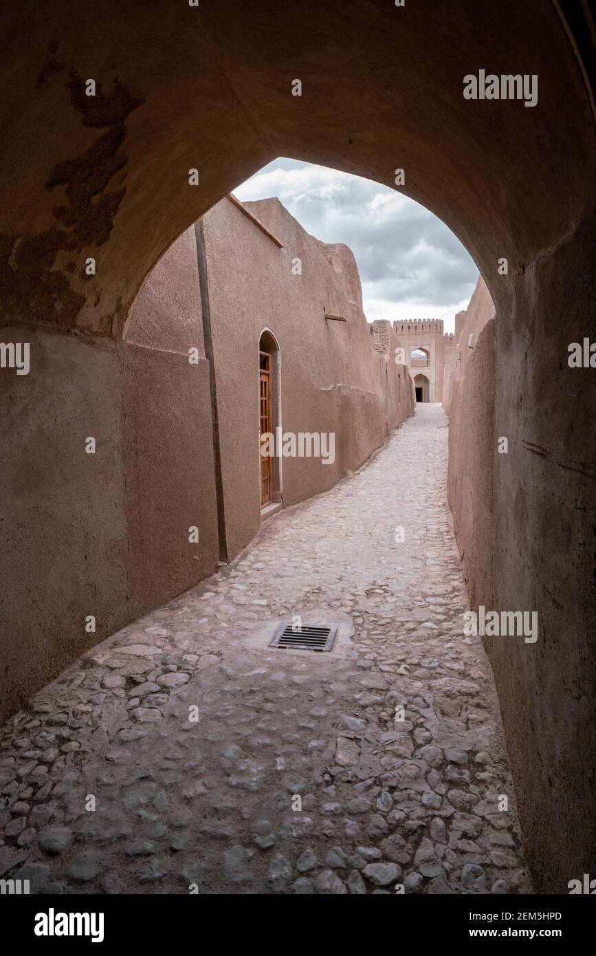 Narrow streets of ancient persian city built from mud bricks. Rayen ...
