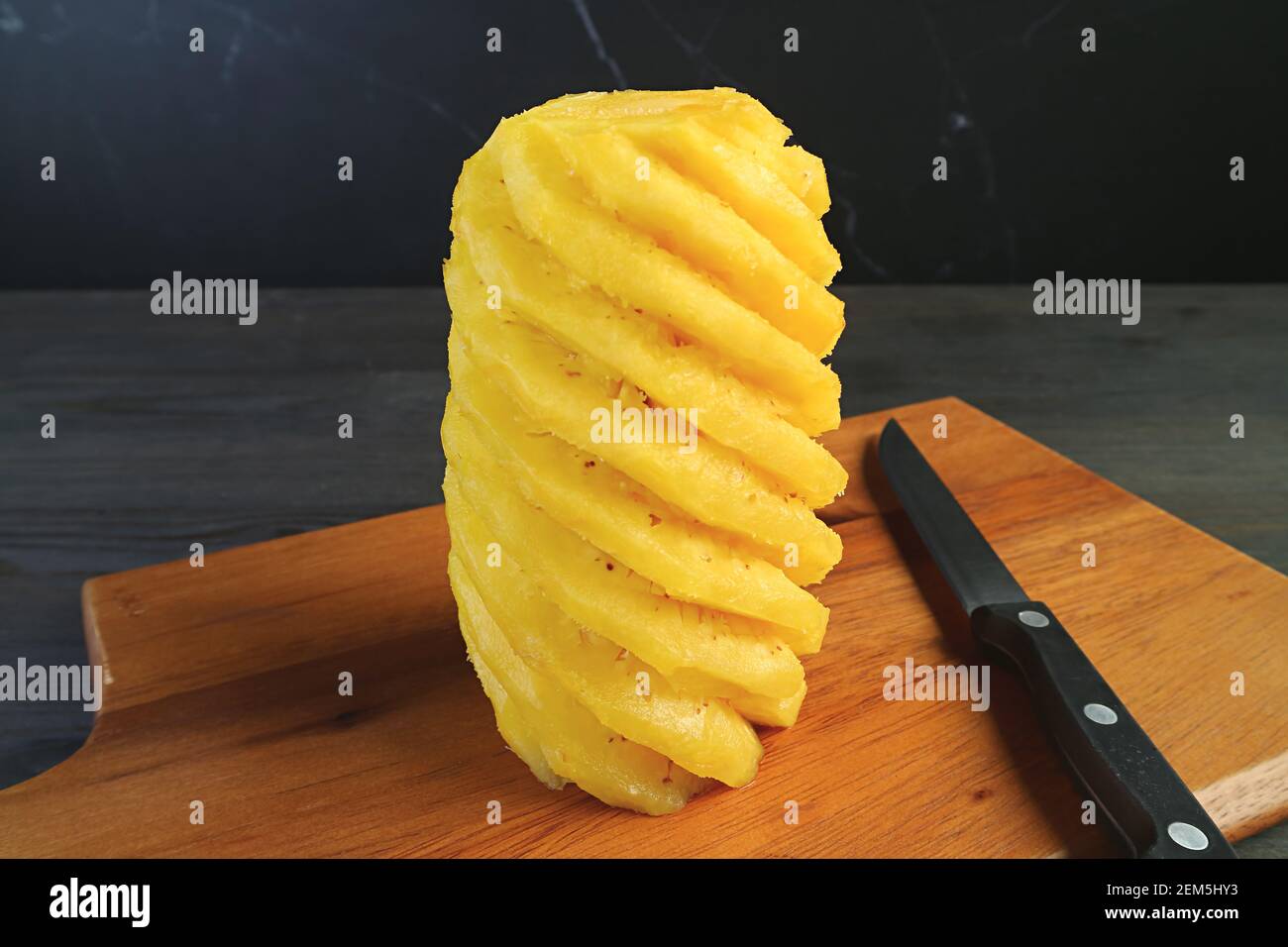 Fresh ripe pineapple peeled and cut in beautiful spiral shape isolated ...