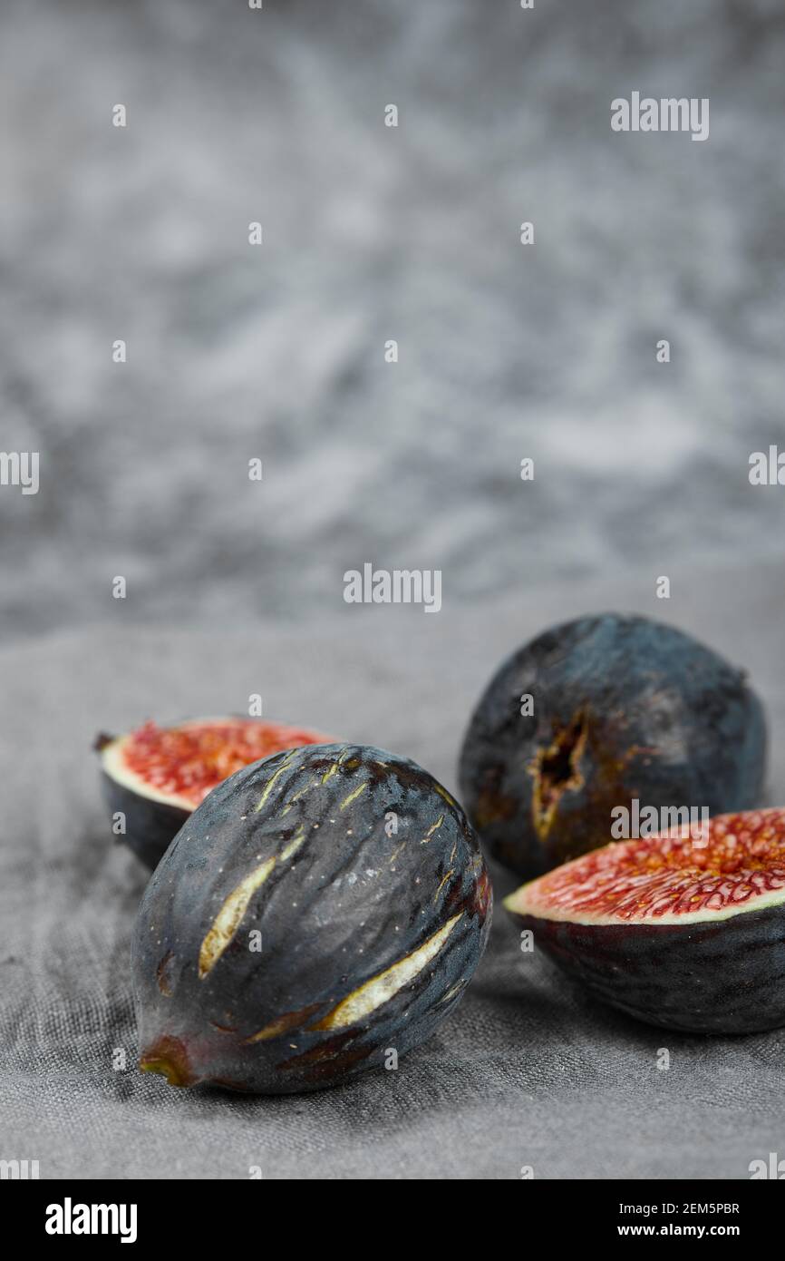 Ripe delicious figs on marble background Stock Photo - Alamy