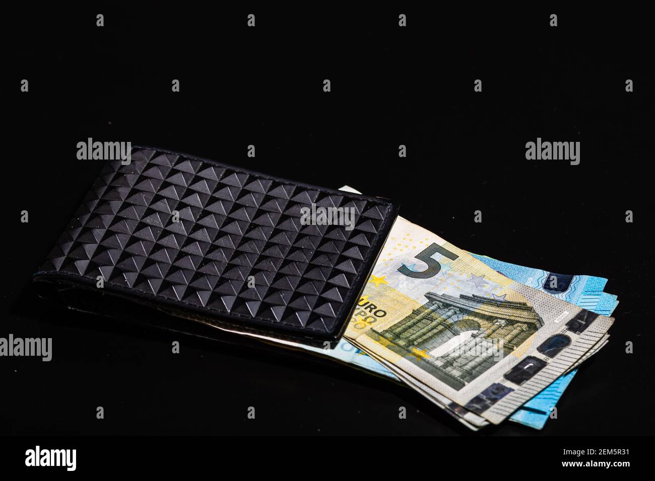 5 Euro money banknotes in black wallet isolated Stock Photo - Alamy