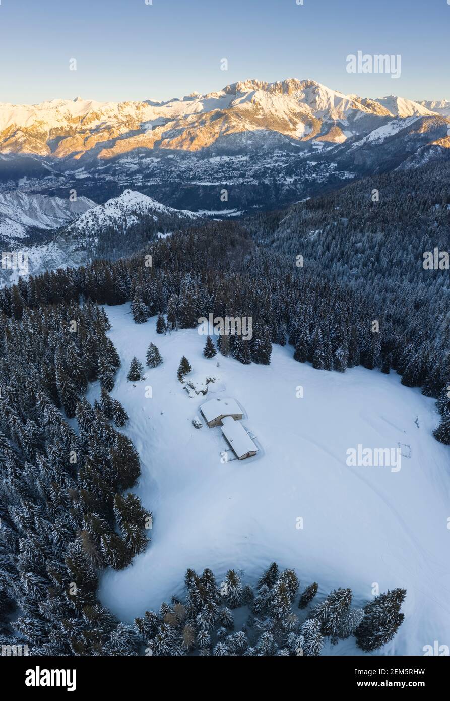 Aerial view of the Valmezzana hut and Presolana massif during a winter ...