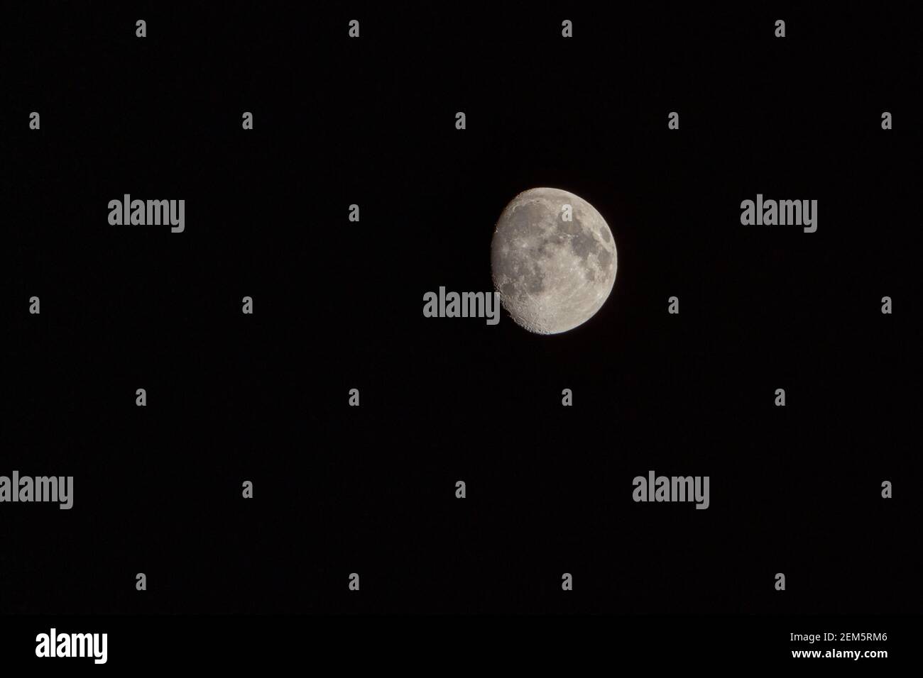 three quarters of the moon in the night sky Stock Photo - Alamy