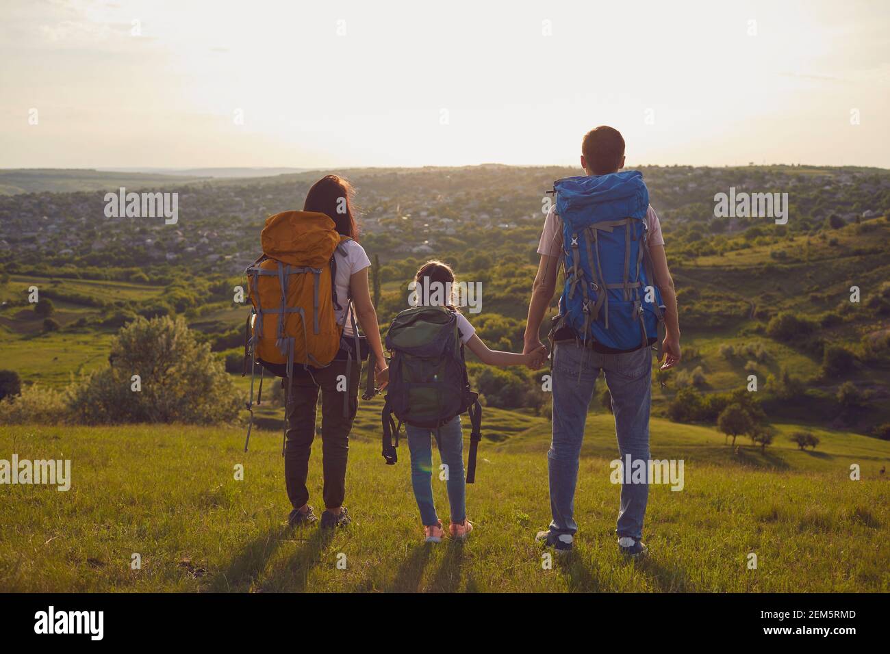 Family with backpacks. Hiker mother father and daughter with backpacks ...