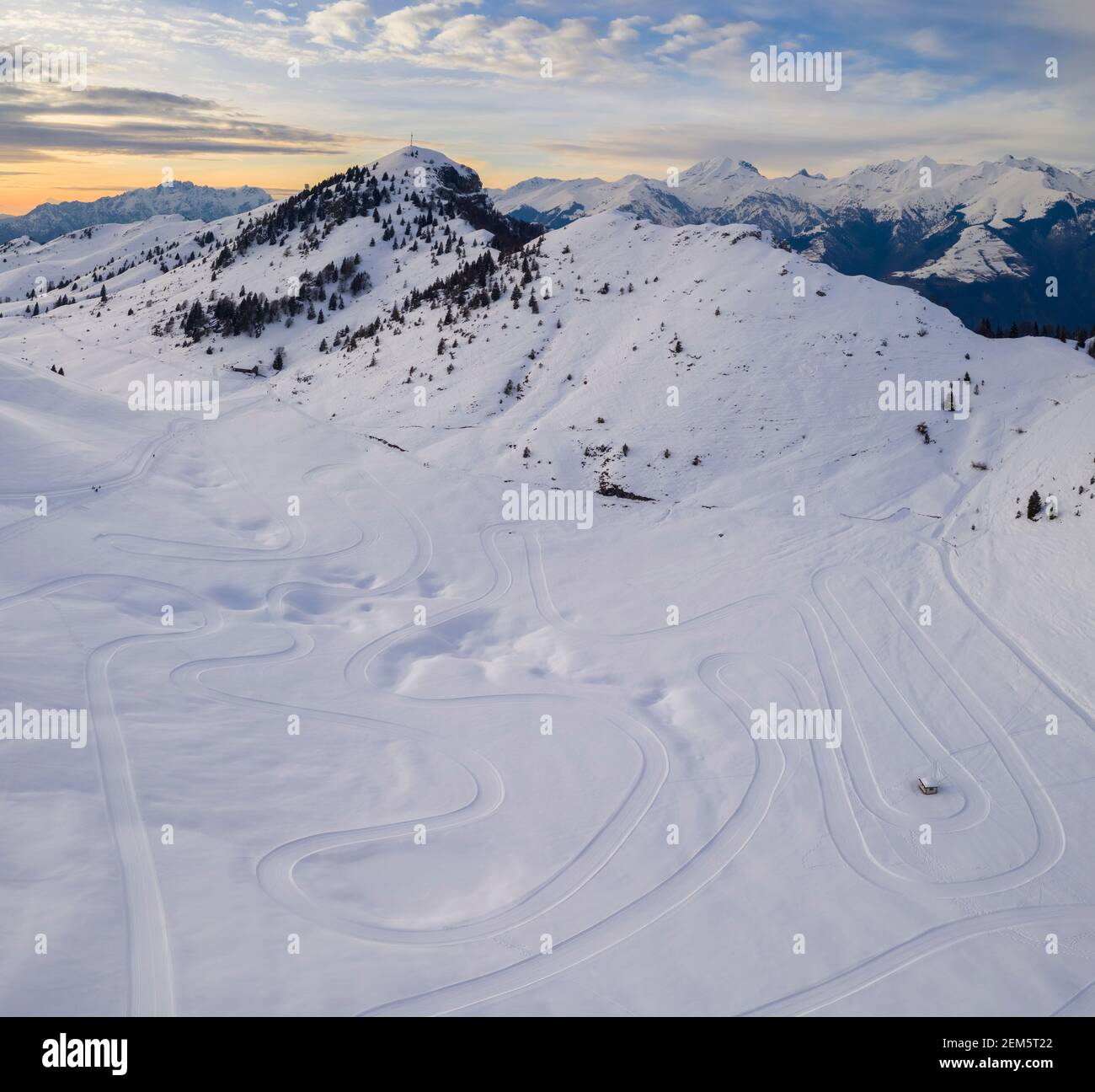 Sunset over a snowy Monte Farno and Pizzo Formico in winter. Monte ...
