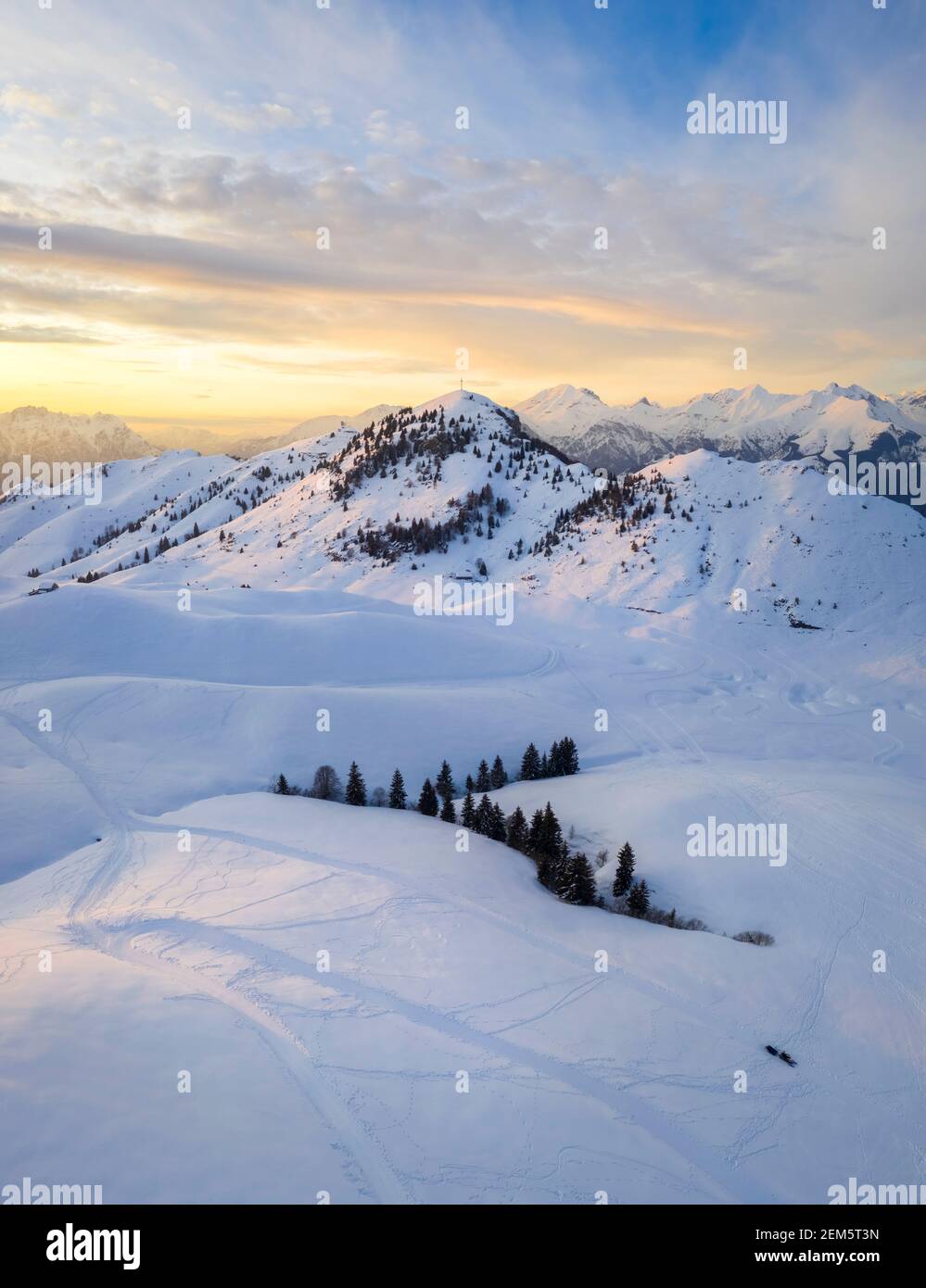 Sunset over a snowy Monte Farno and Pizzo Formico in winter. Monte ...