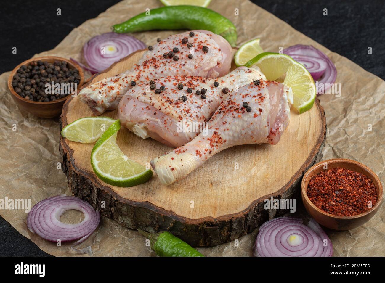 Raw fresh chicken legs. with spices and vegetables Stock Photo - Alamy