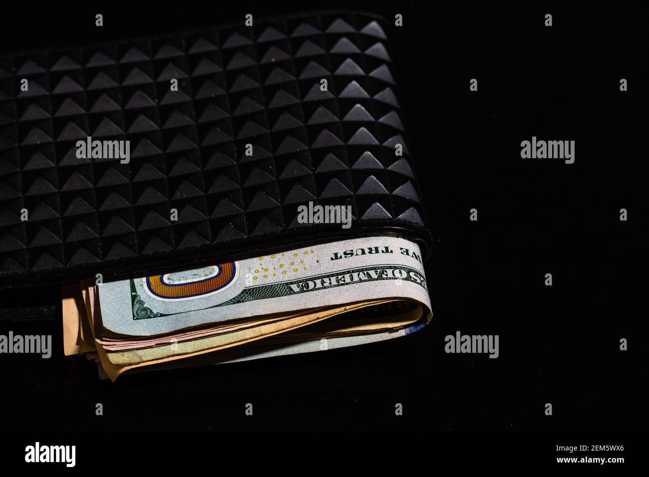 Dollars money banknotes in a black wallet isolated Stock Photo - Alamy