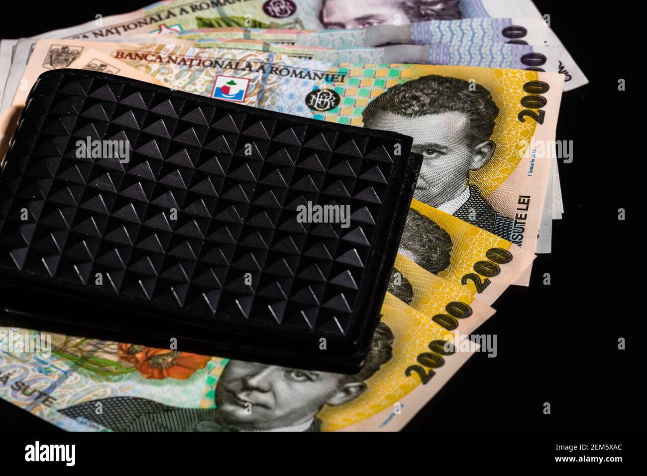 LEI romanian money banknotes in black wallet isolated Stock Photo - Alamy